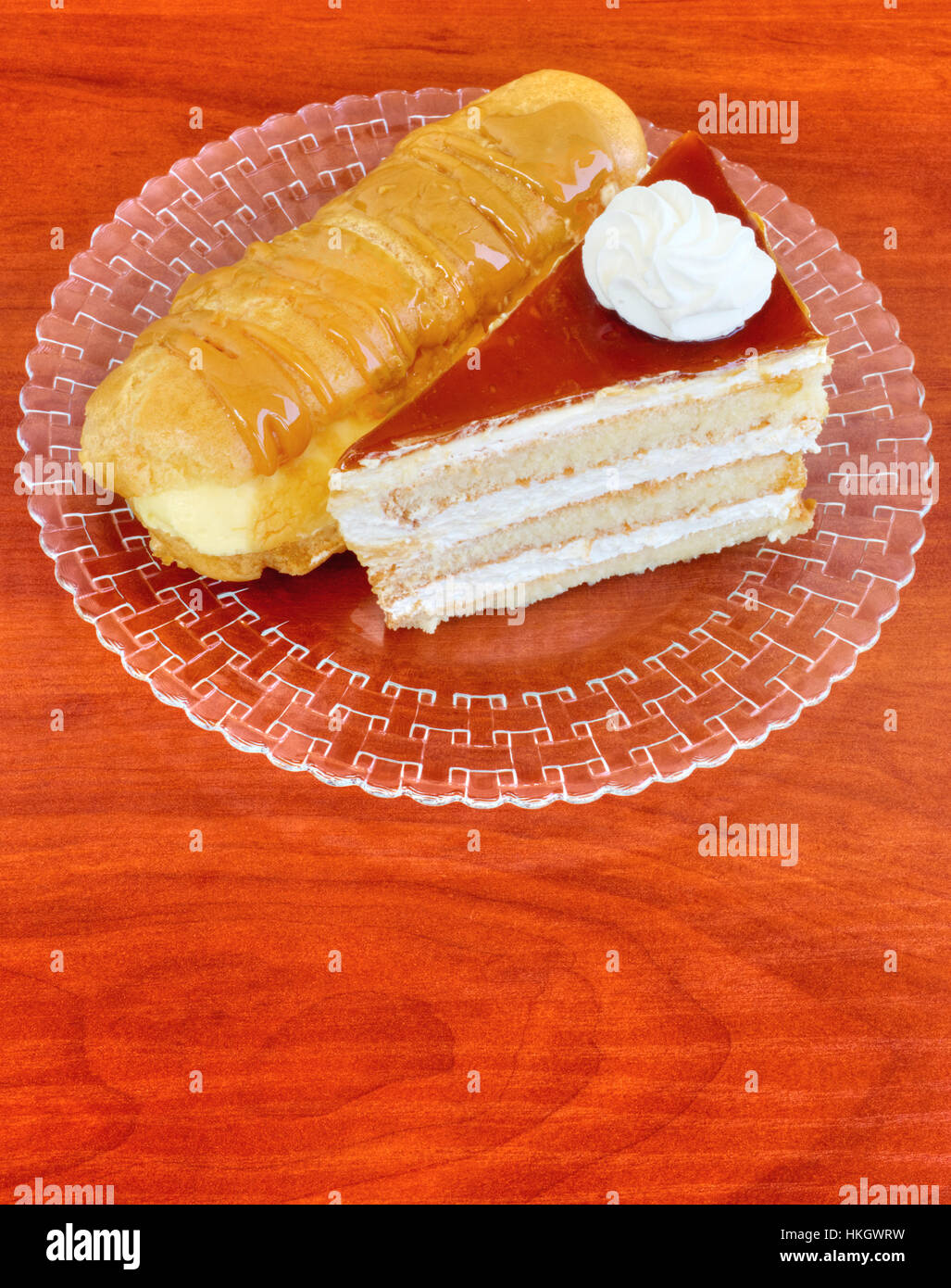 Sweet cake and eclairs closeup Stock Photo - Alamy