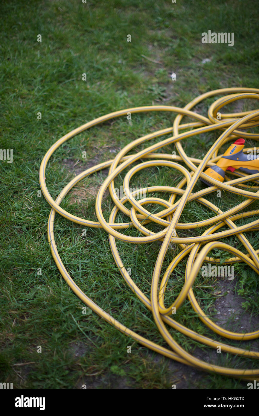 Sprinkler pipe at garden tangled hi-res stock photography and images ...