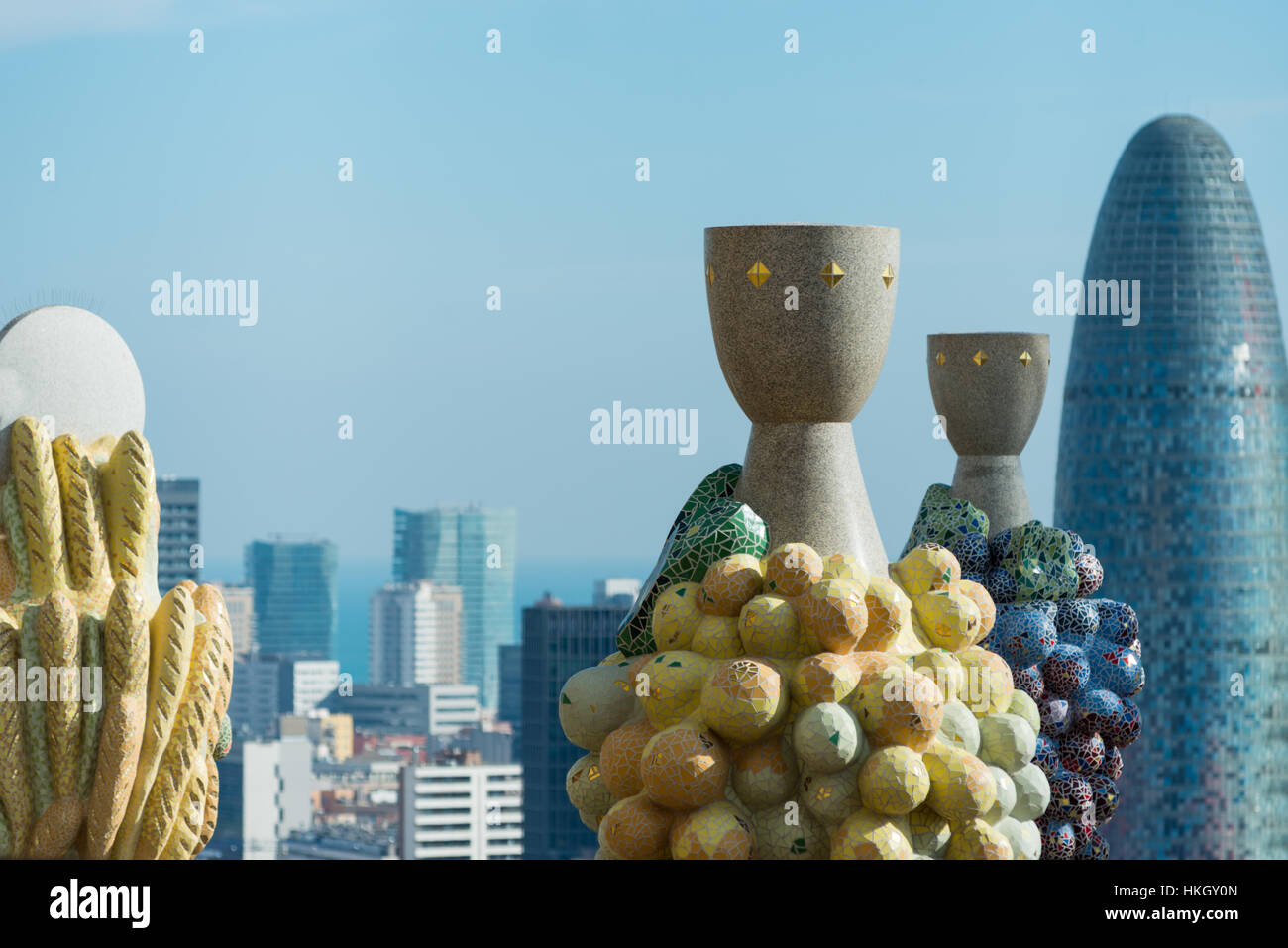 A mix of Gaudi sculptures and city buildings making up the city skyline ...