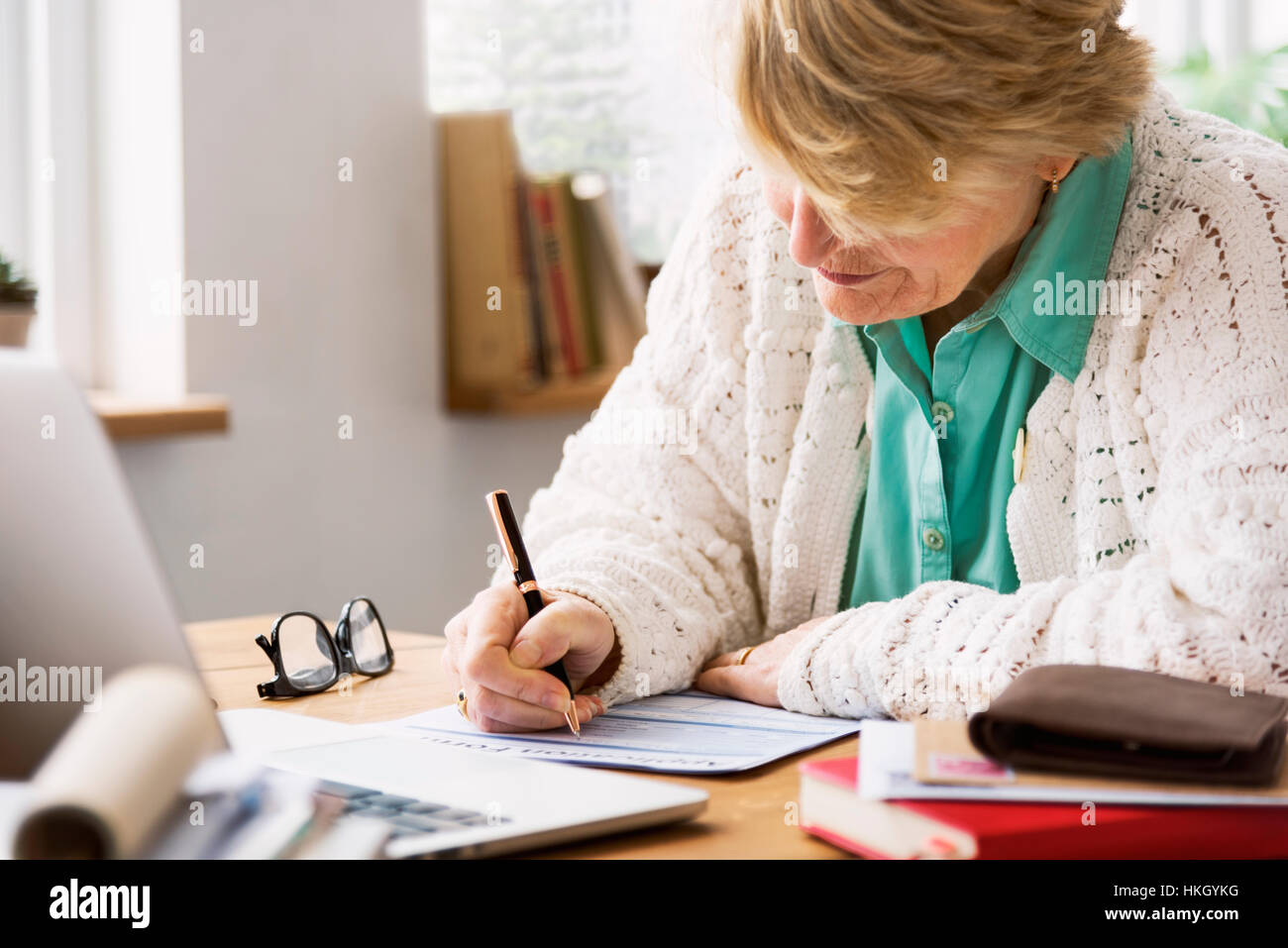 Senior Woman Filling Application Form Documents Concept Stock Photo - Alamy