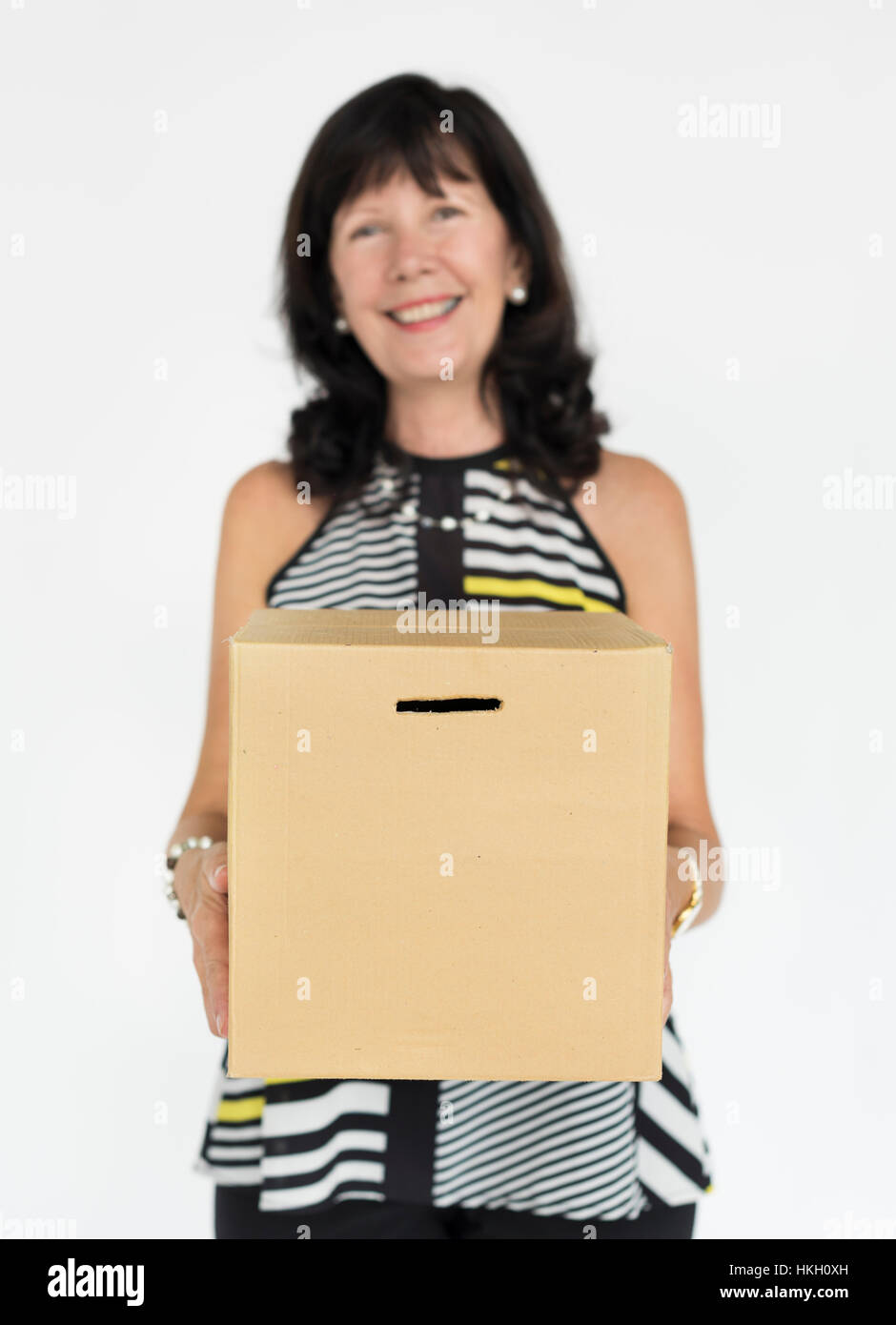 Adult Female Standing Holding Box Smiling Concept Stock Photo - Alamy