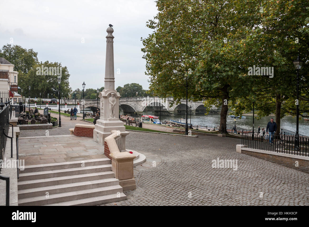 The stone pillar war memorial to World War One & Two near to the Thames ...