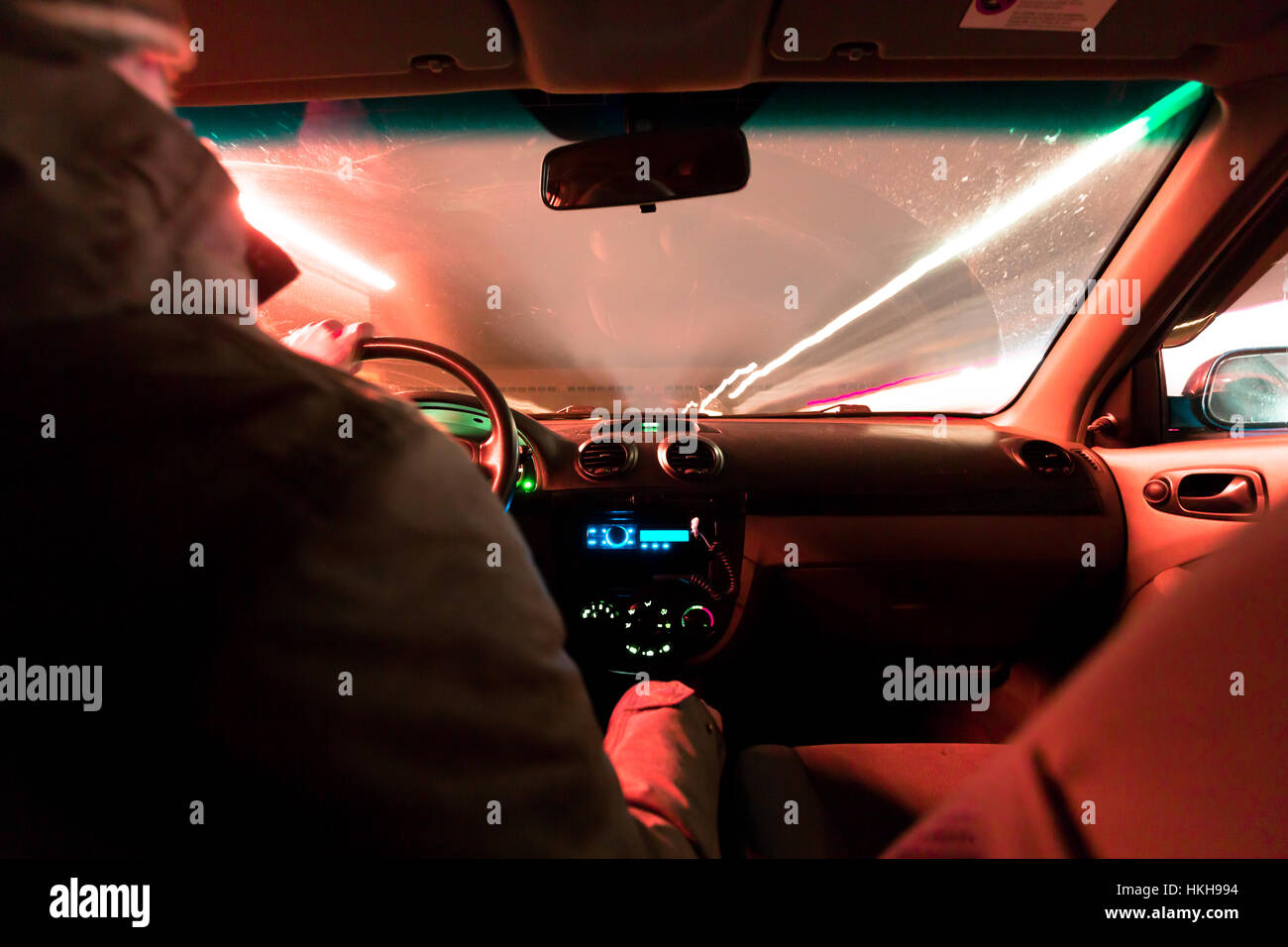 Riding on cars on the road at night Stock Photo - Alamy