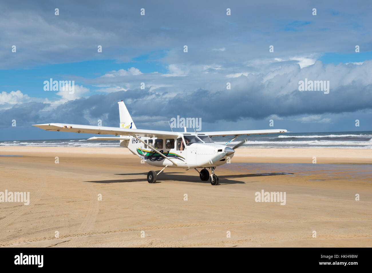 A small airplane landing on 75 mile beach on Fraser Island, Queensland ...