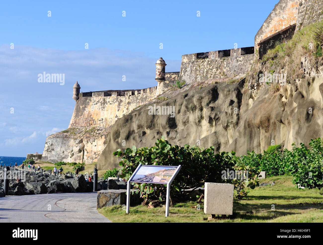 People walk next to castle in Puerto Rico Stock Photo - Alamy