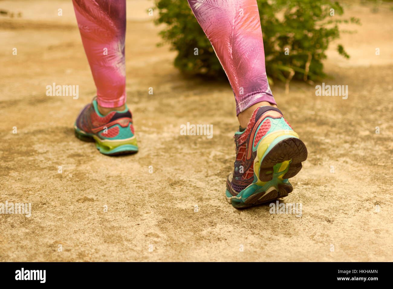 Runner feet running on road closeup on shoes. Woman fitness sunrise jog ...
