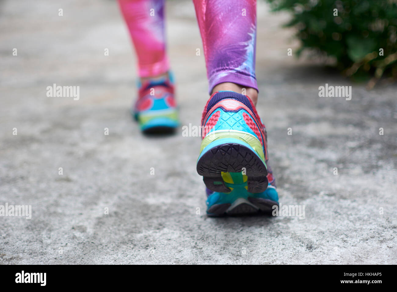 Runner feet running on road closeup on shoes. Woman fitness sunrise jog ...