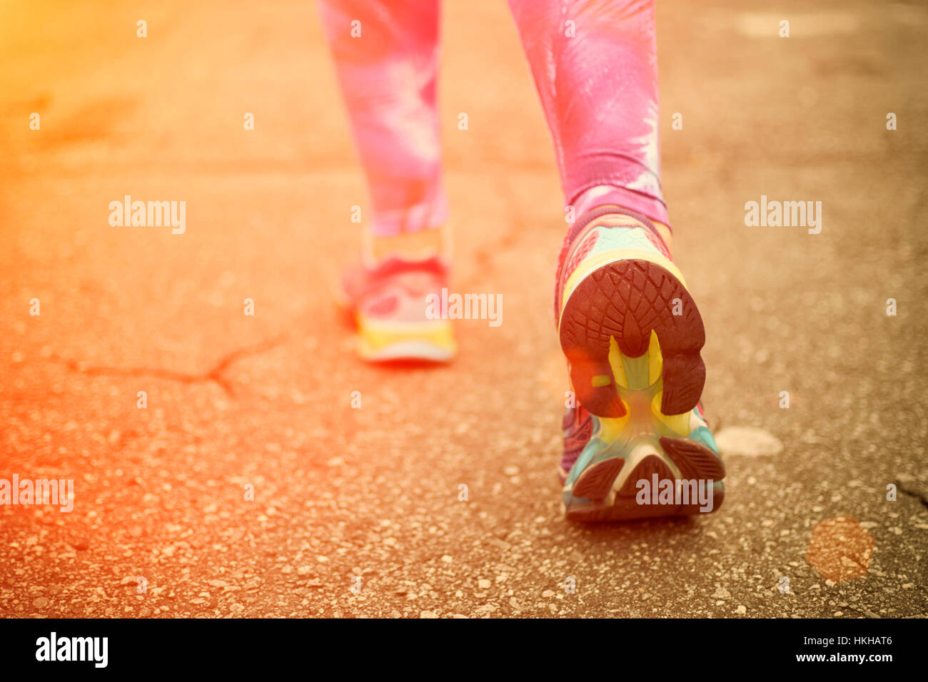 Runner feet running on road closeup on shoes. Woman fitness sunrise jog ...
