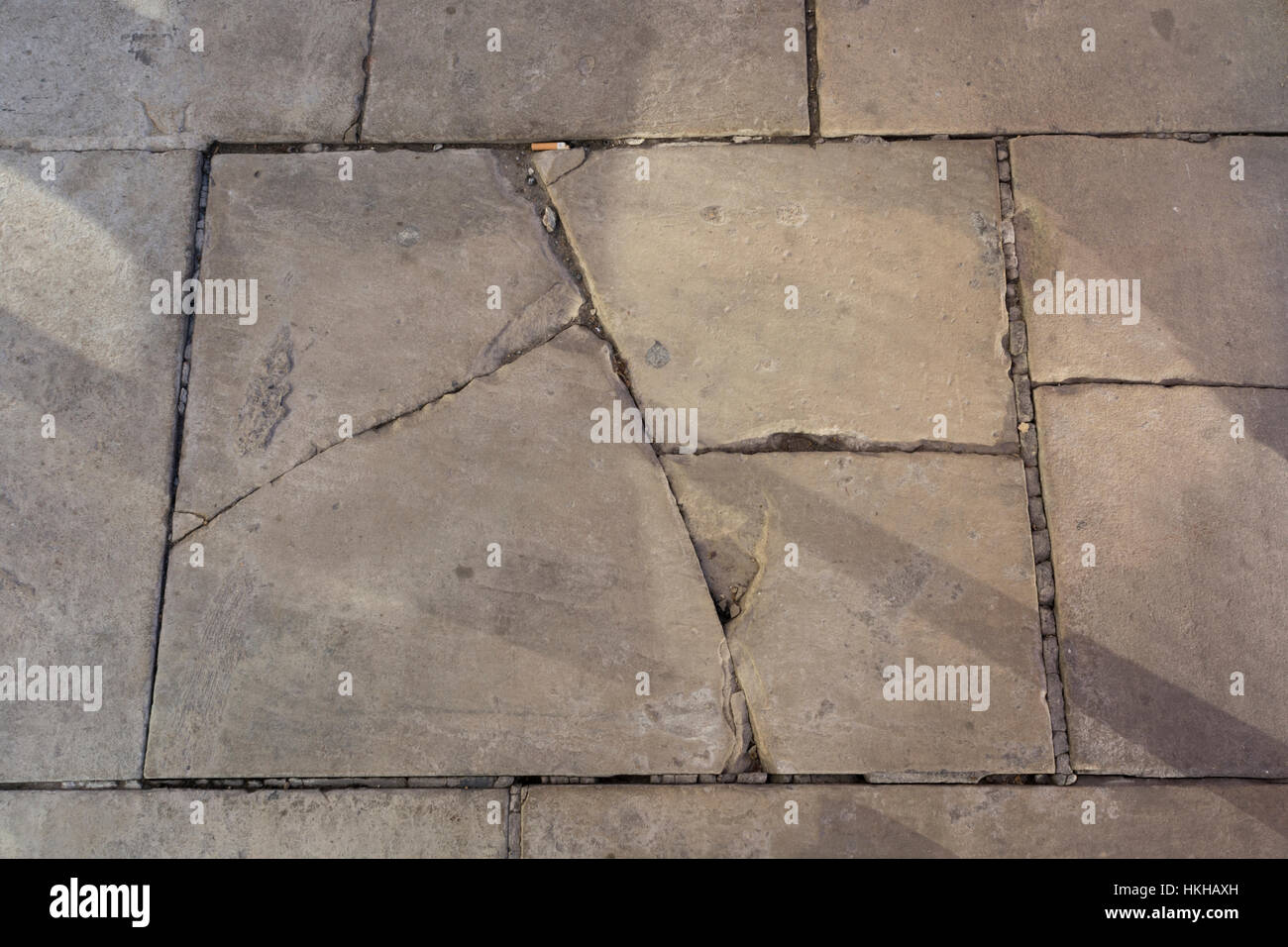 Cracked flag stone / flagstones in pavement along London's River Thames ...