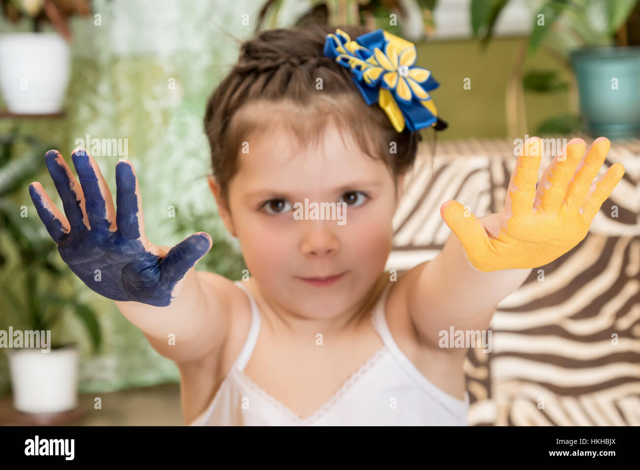 Child with outstretched hands painted Stock Photo - Alamy