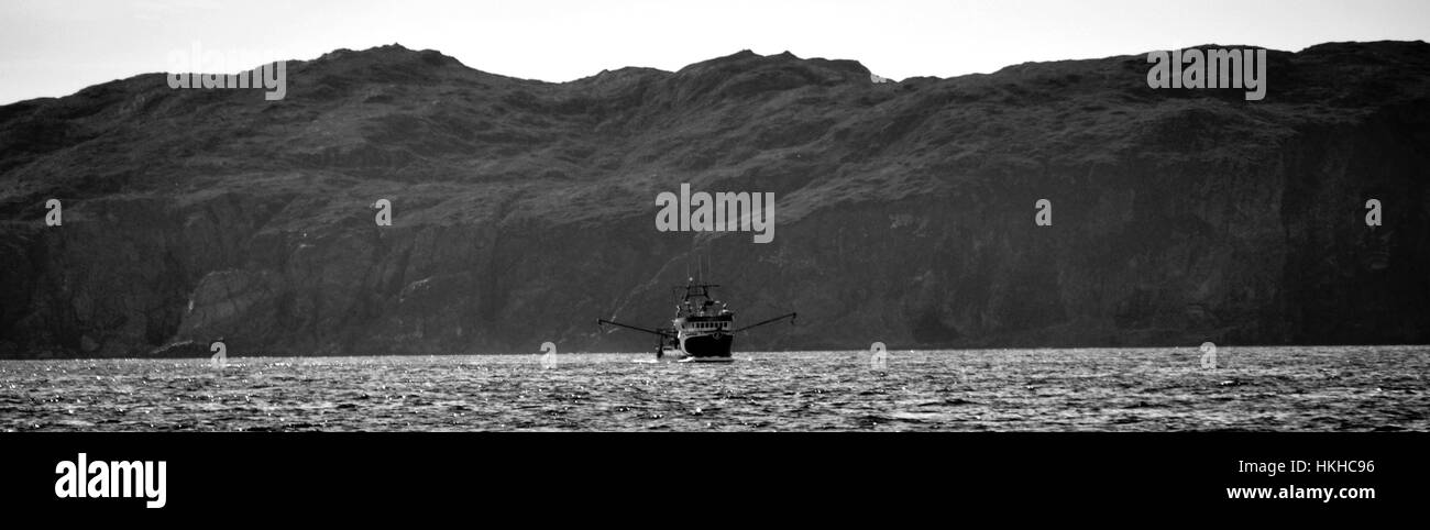 Fishing trawler leaving the port of St. Anthony, Newfoundland, Canada ...