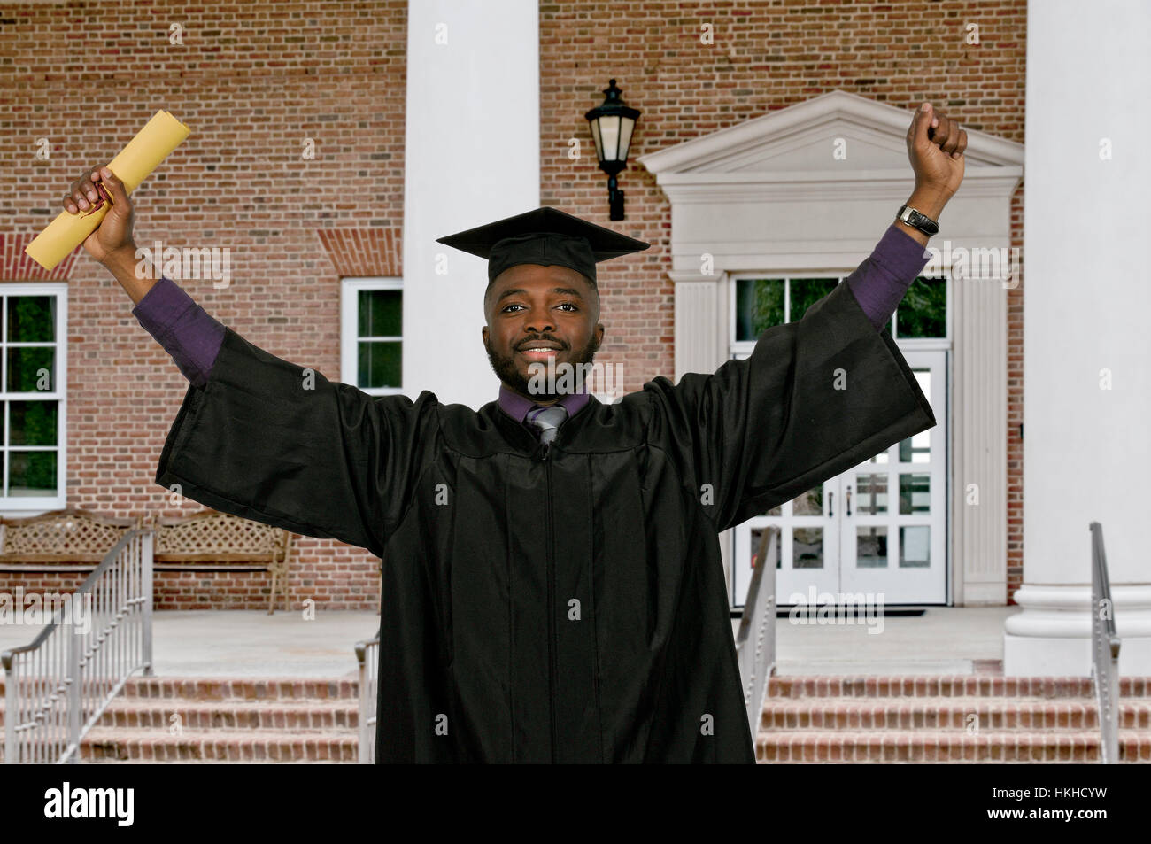 Young black African American man in his graduation robes Stock Photo ...