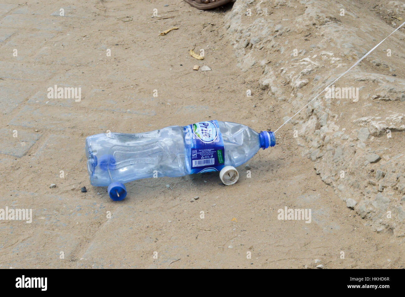 Plastic bottle transform into small car with wheels in stoppers Stock ...