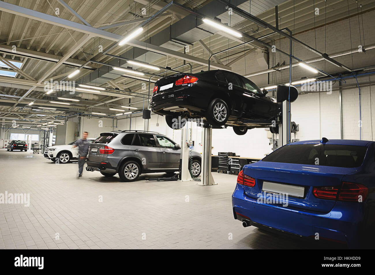 Car repairing in big and clean garage Stock Photo - Alamy