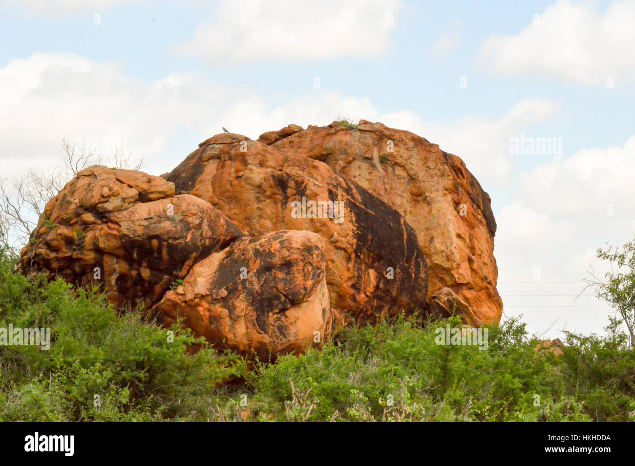 Enormous red rock on a hill in a park in Kenya Stock Photo - Alamy