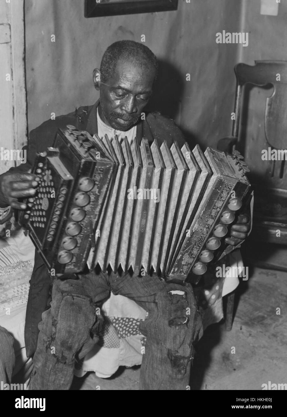 Man who sitting in Black and White Stock Photos & Images - Alamy