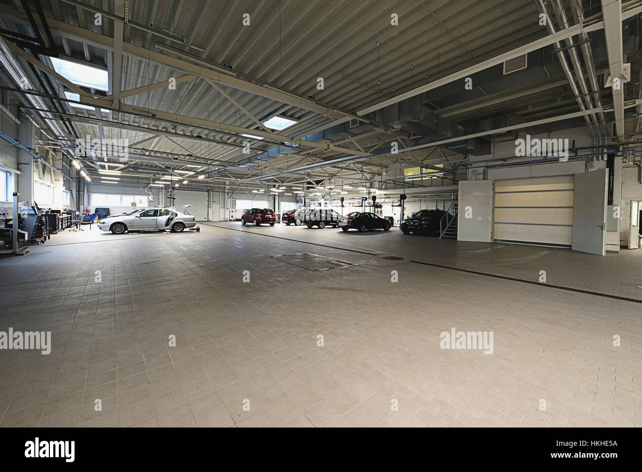modern car repairing in big and clean garage Stock Photo - Alamy