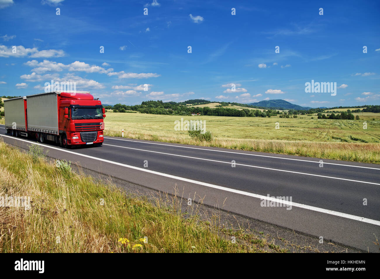 Rural landscape with road you are driving a red truck, in the ...