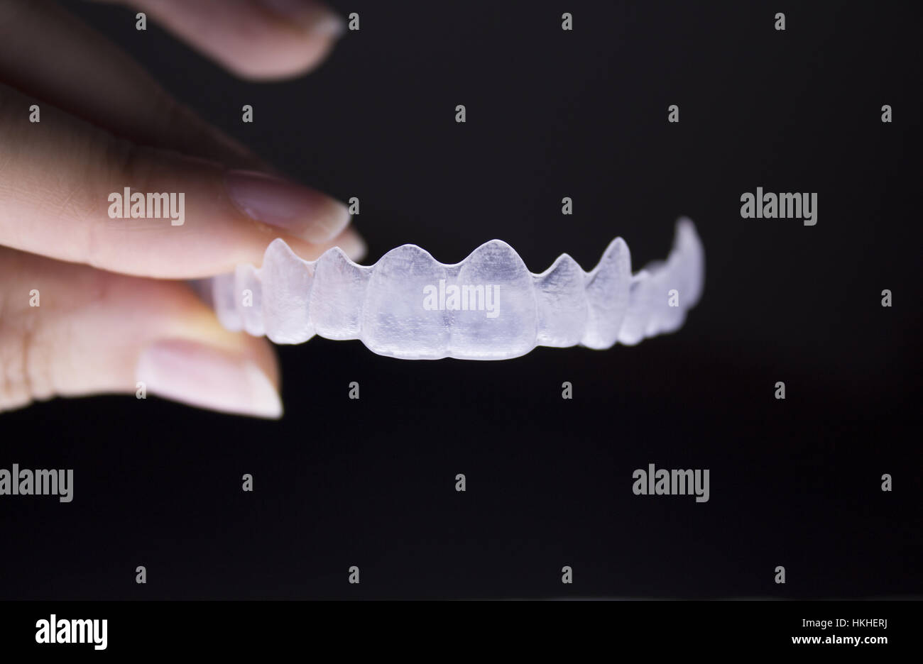 Invisible dental retainer held hi-res stock photography and images - Alamy