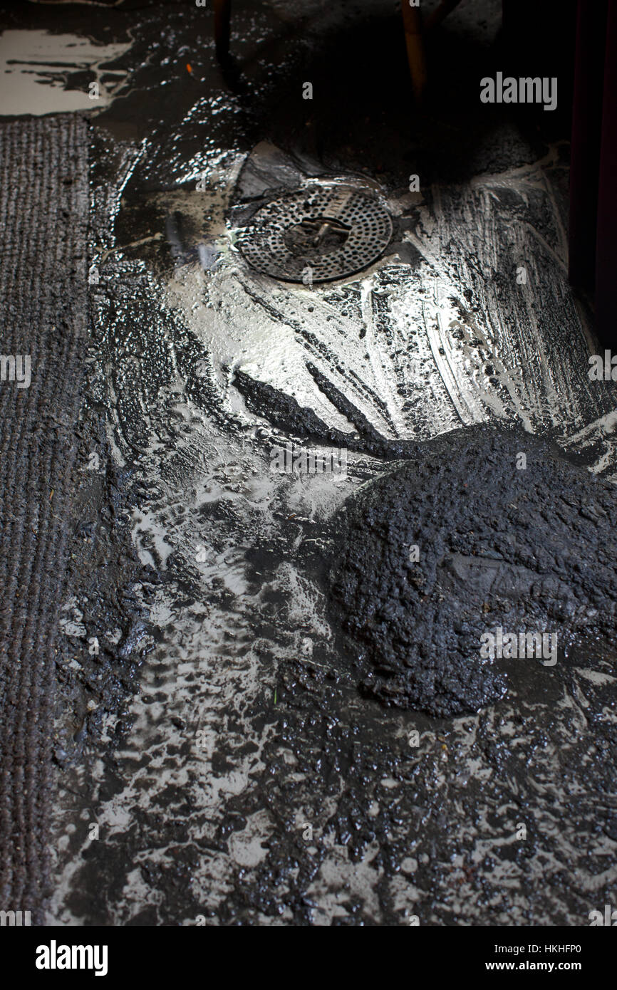 wet mud near sewage lid. unhygienic, cloudburst, flood, manhole Stock ...