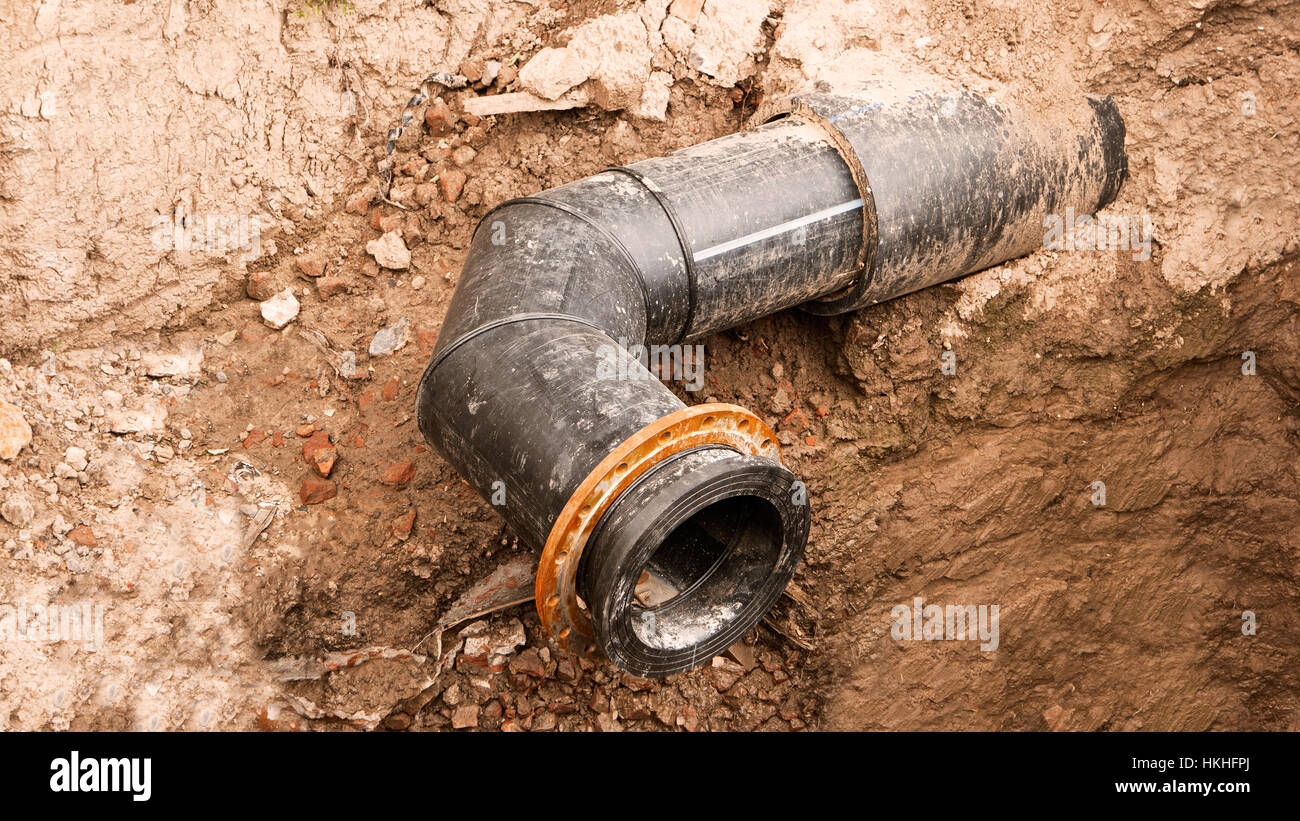 Ditch with open modern PVC water large diameter pipe in its side Stock ...