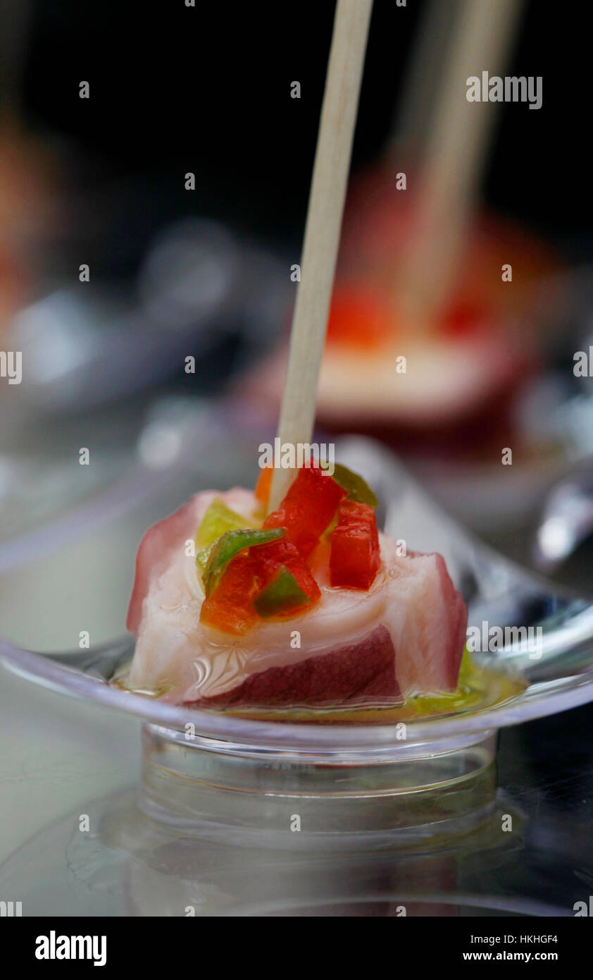 Canape od octopus with pepper served on a plate Stock Photo - Alamy