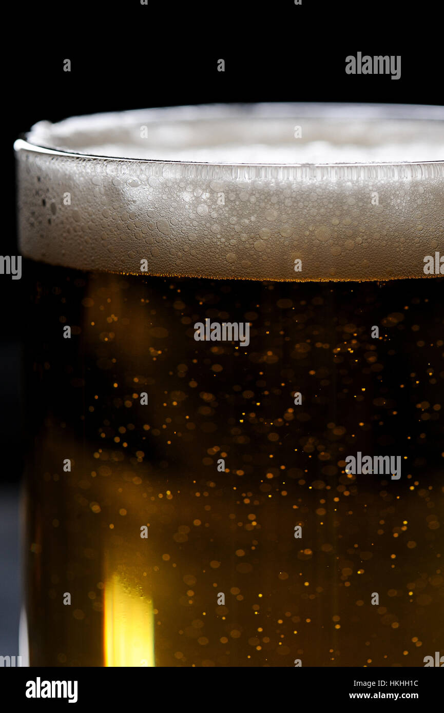 close up beer glass with foam on top Stock Photo - Alamy
