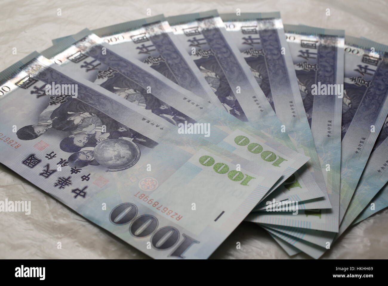 Currency of 10000 new Taiwan dollars display on table.Currency of 10000 ...