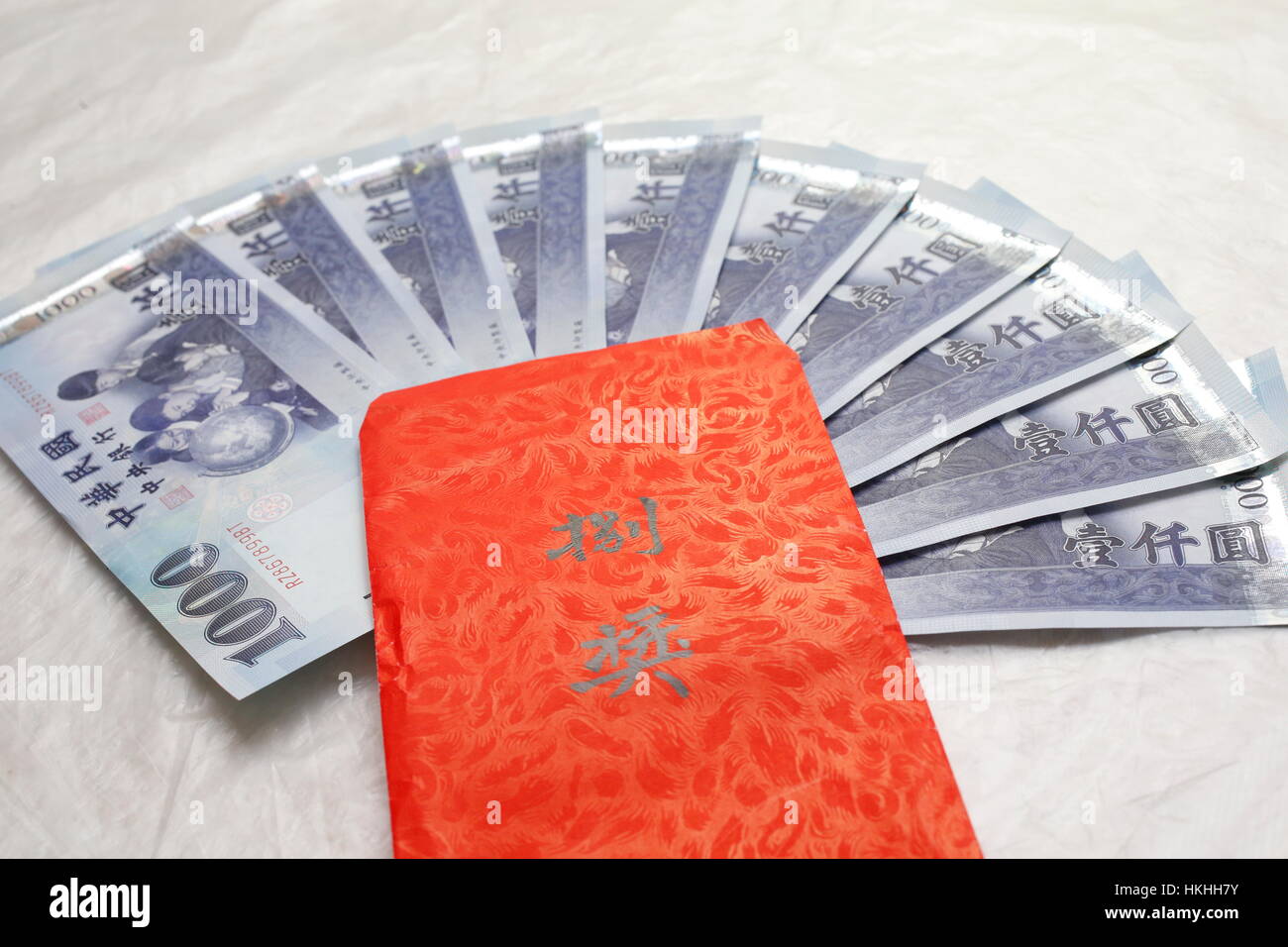 Currency of 10000 new Taiwan dollars display on table Stock Photo - Alamy
