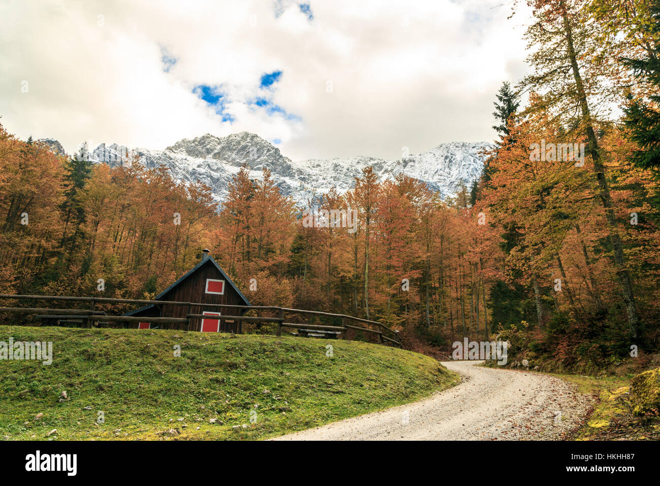 an alpine hut in the valley during a colorful sunset Stock Photo - Alamy