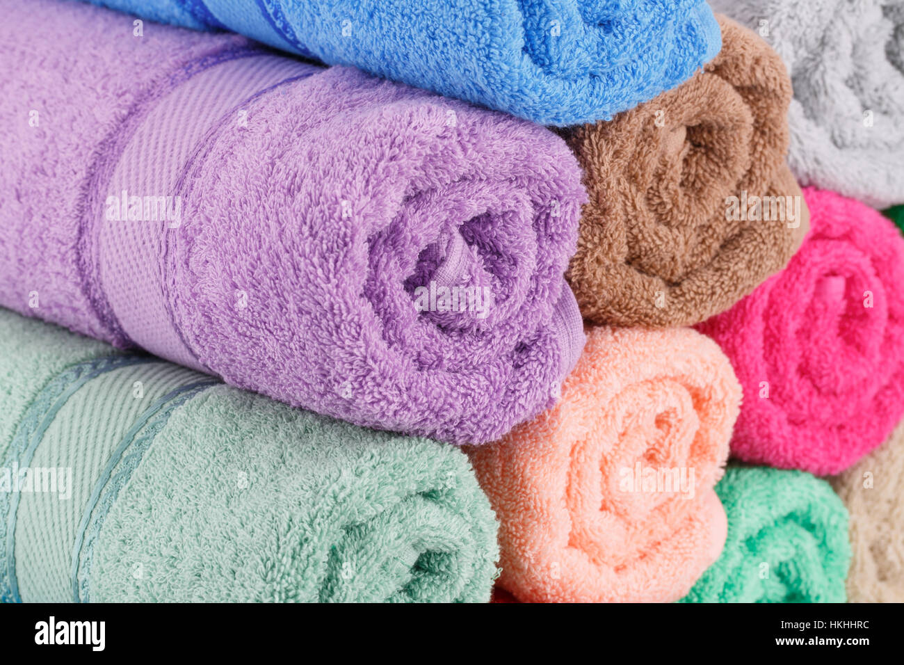 Colorful rolled towels stack closeup picture Stock Photo - Alamy