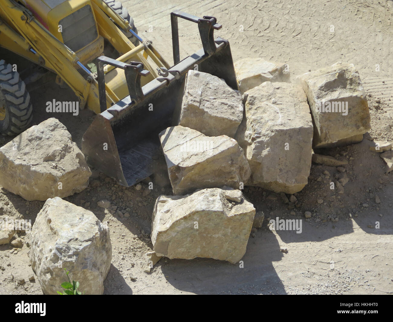 Backhoe loader rocks hi-res stock photography and images - Alamy