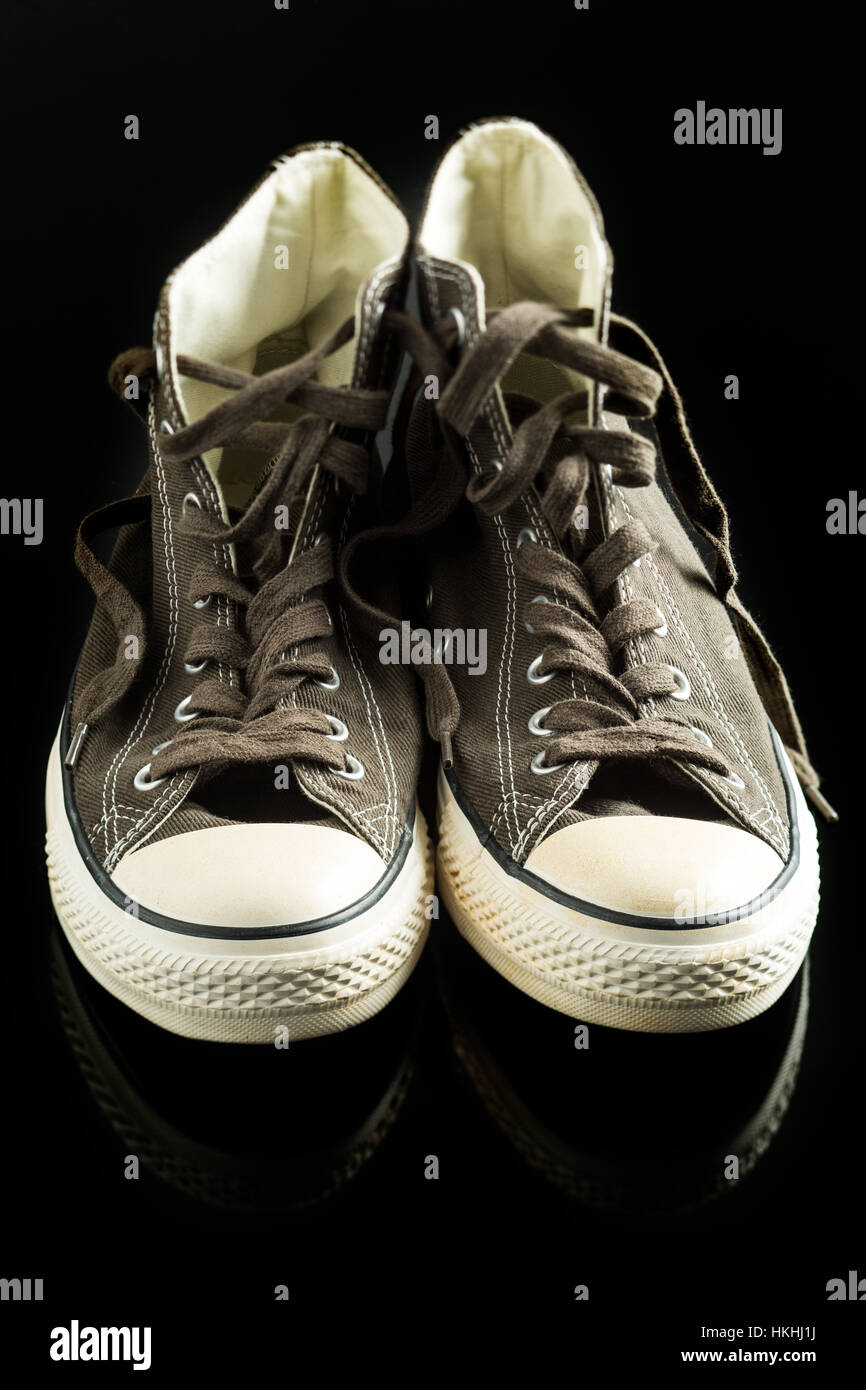 The vintage sneakers on black table Stock Photo - Alamy
