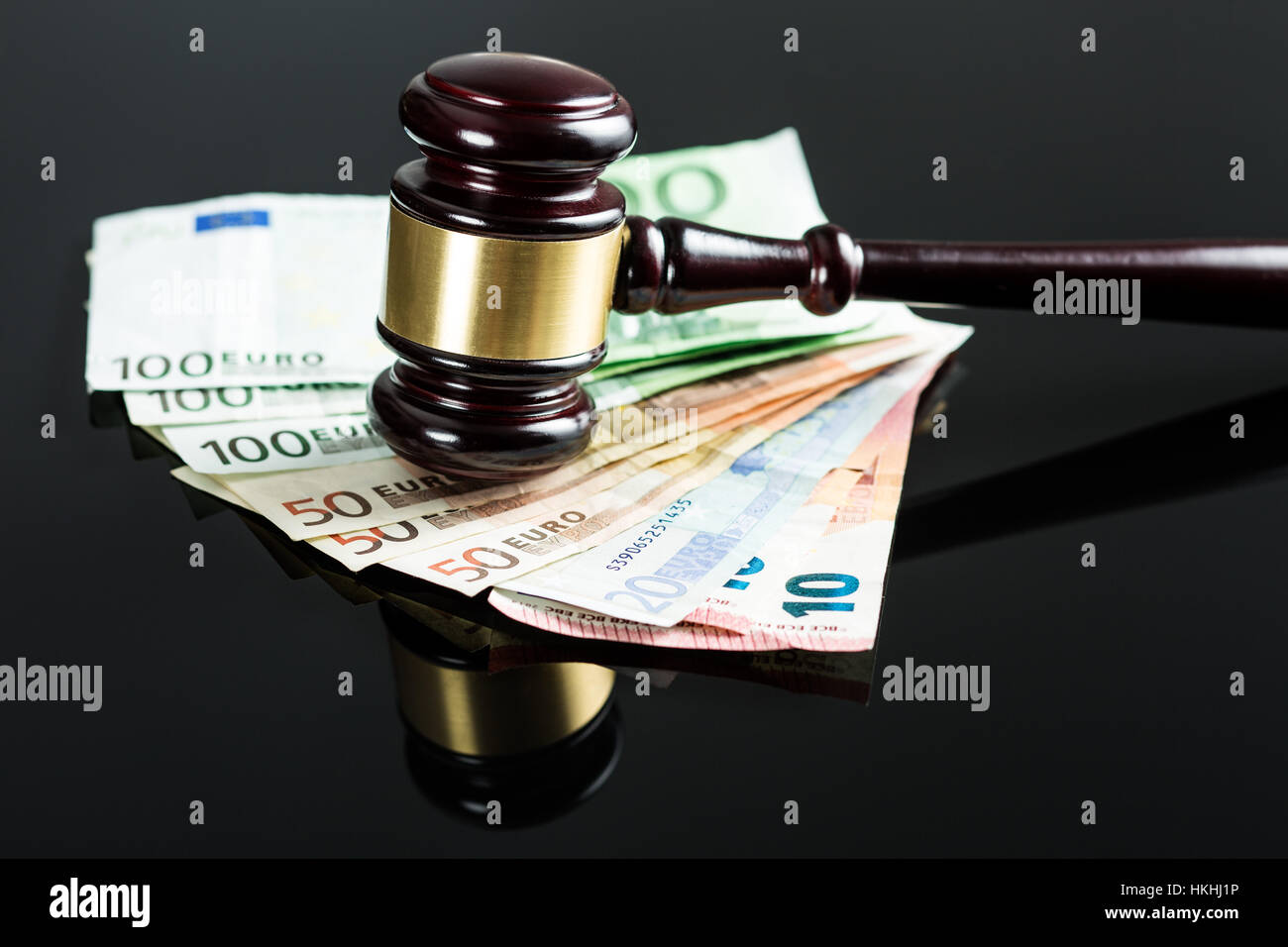 Gavel and euro money on black table Stock Photo - Alamy
