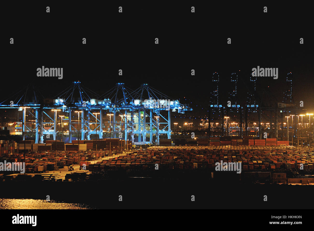 containers in warehouse port at night light Stock Photo - Alamy