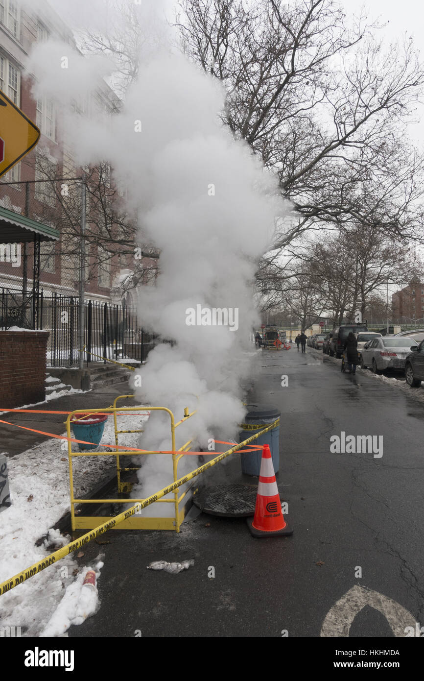 Smoke rises from a manhole due to an underground electrical fire in ...