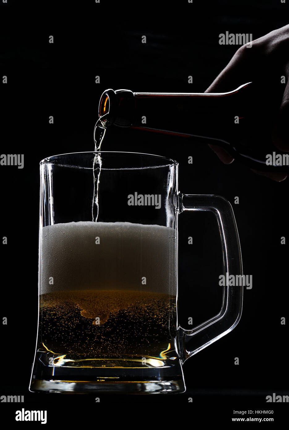 Pouring fresh beer on golden hi-res stock photography and images - Alamy