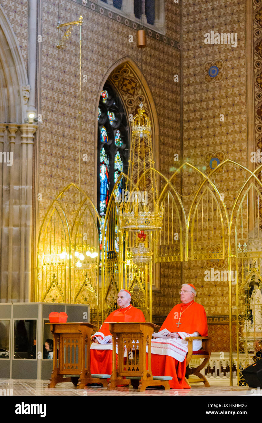 Two Roman Catholic bishops sit on chairs in a cathedral Stock Photo - Alamy