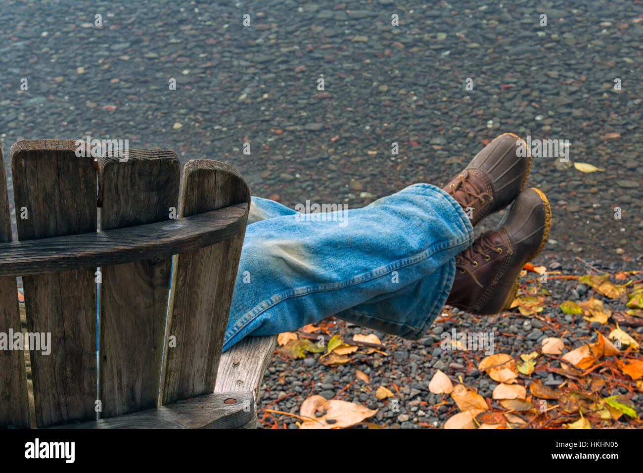 Legs on bench Stock Photo - Alamy