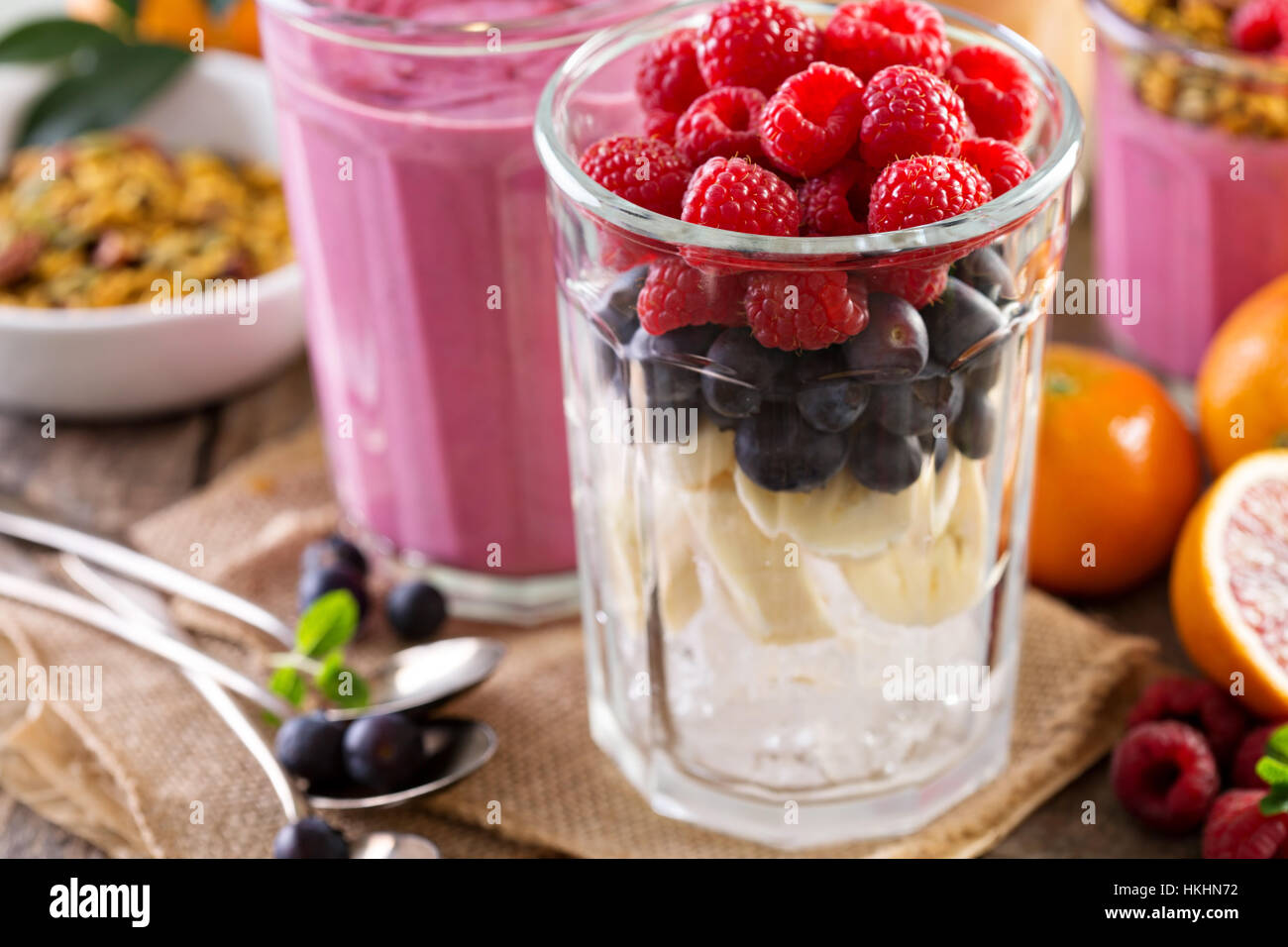 Berry smoothie ingredients in tall glass Stock Photo - Alamy