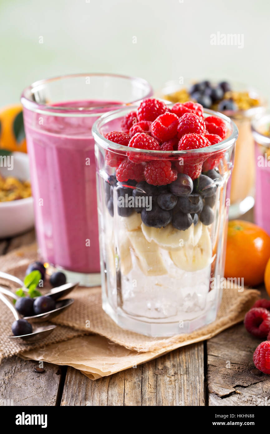 Berry smoothie ingredients in tall glass Stock Photo - Alamy