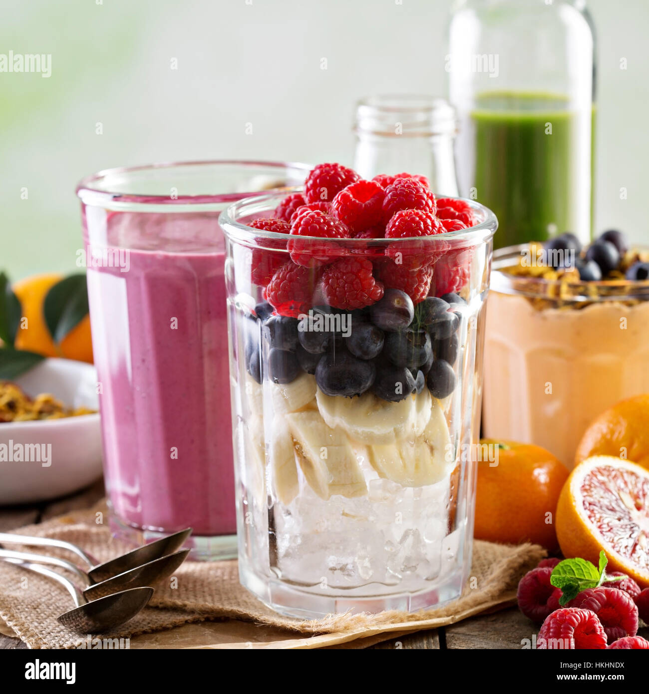 Berry smoothie ingredients in tall glass Stock Photo - Alamy