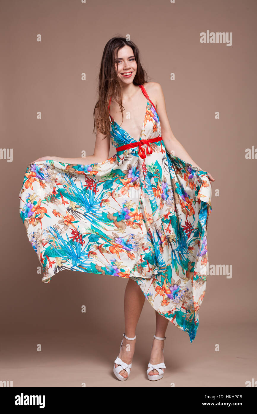 girl in colored dress posing smiles Stock Photo - Alamy