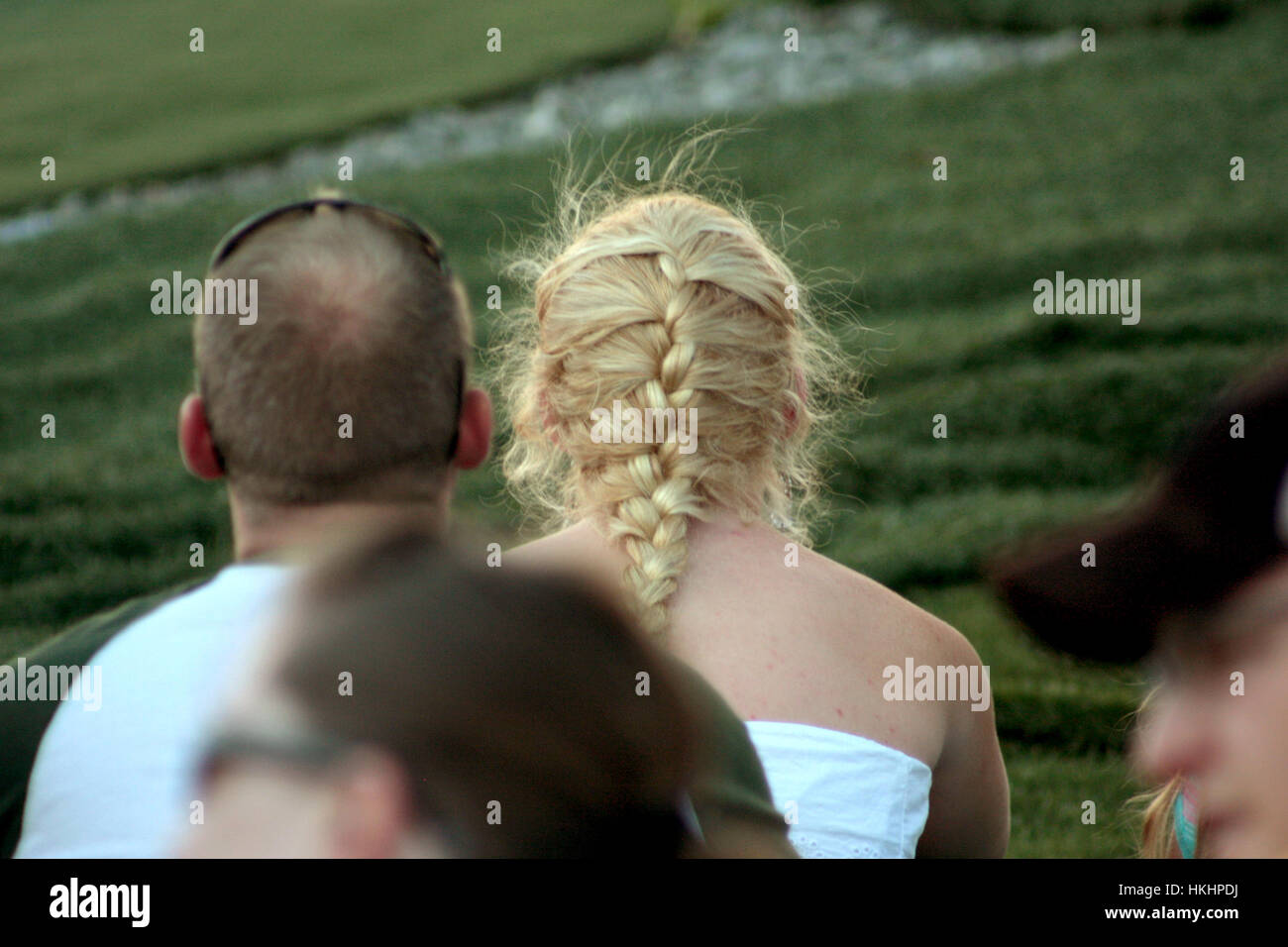 Woman with braided hair at outdoor event Stock Photo - Alamy