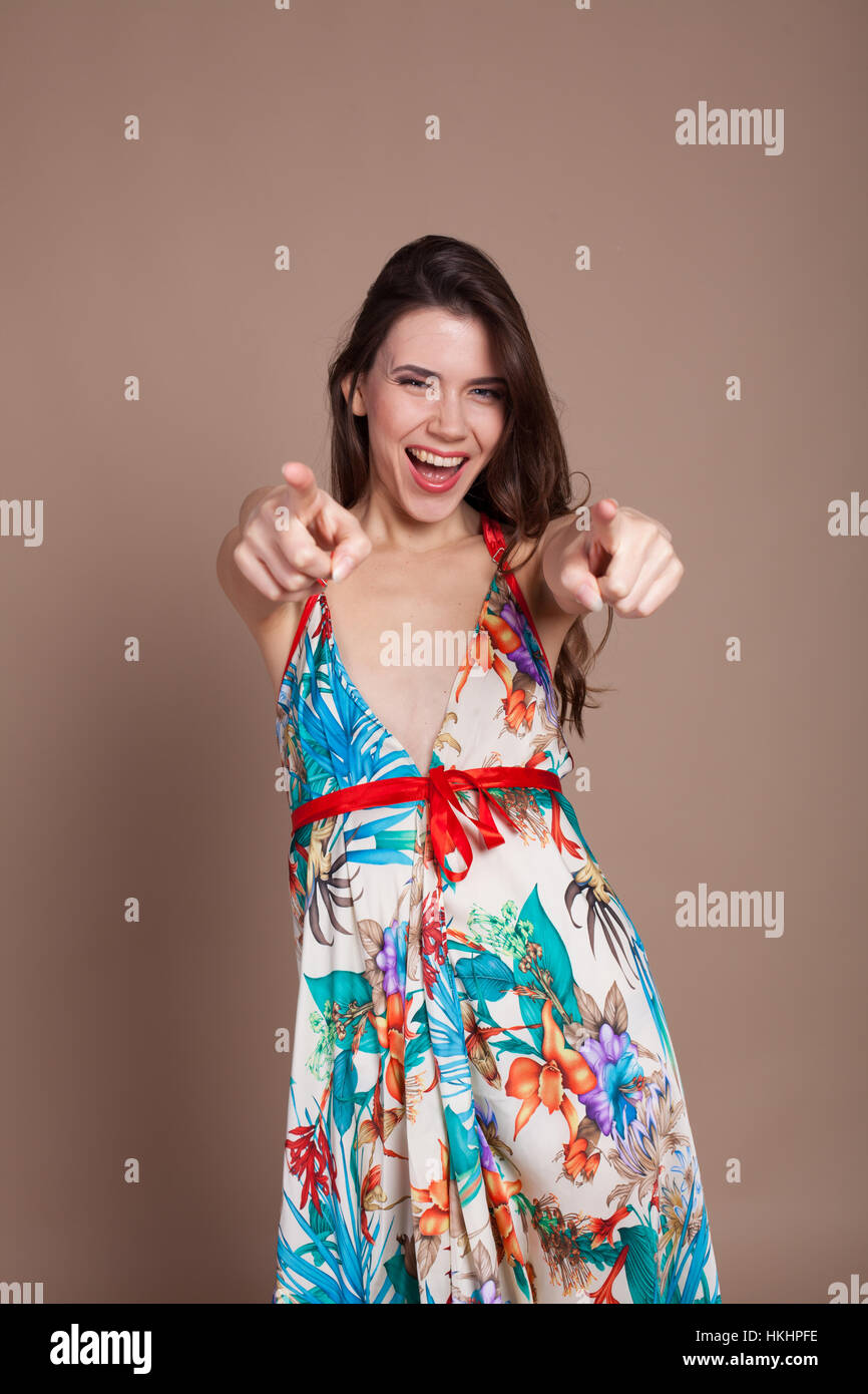 girl in colored dress shows fingers Stock Photo - Alamy