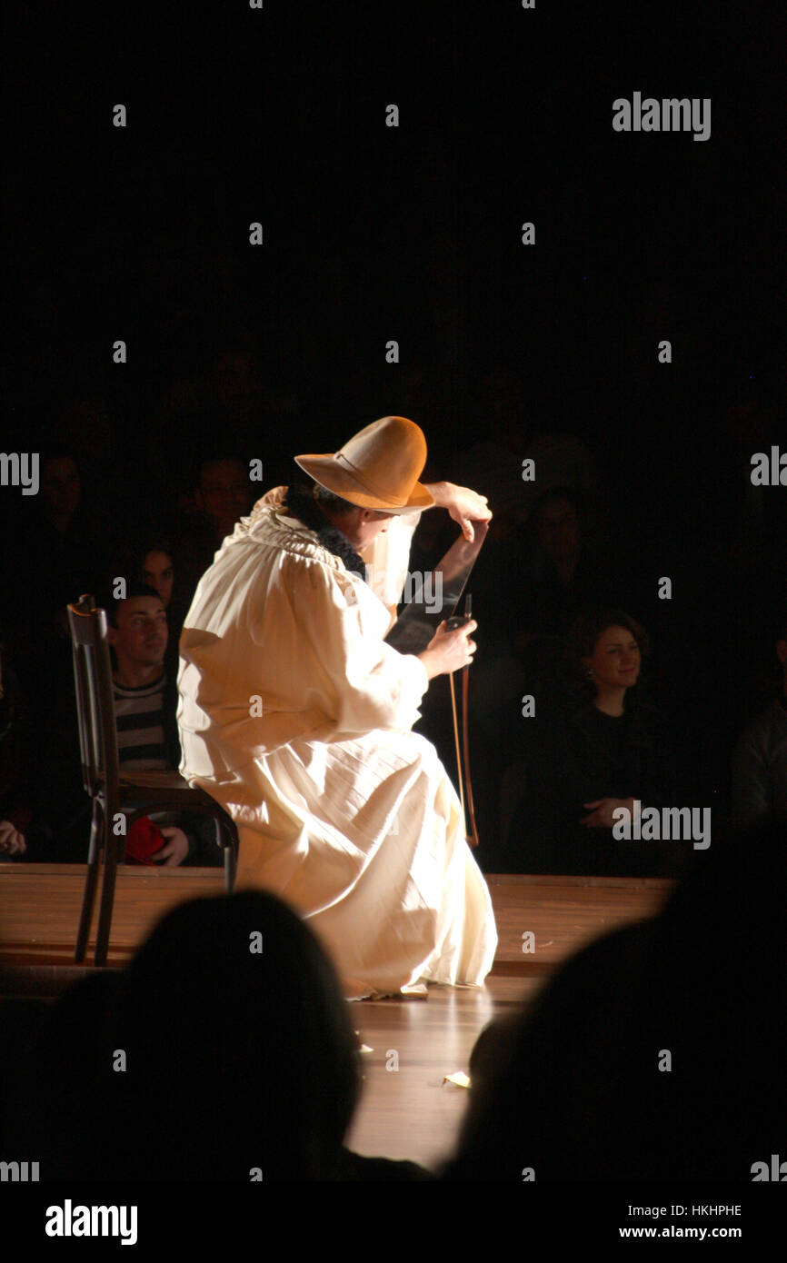 Actor performing on the stage in front of spectators Stock Photo - Alamy