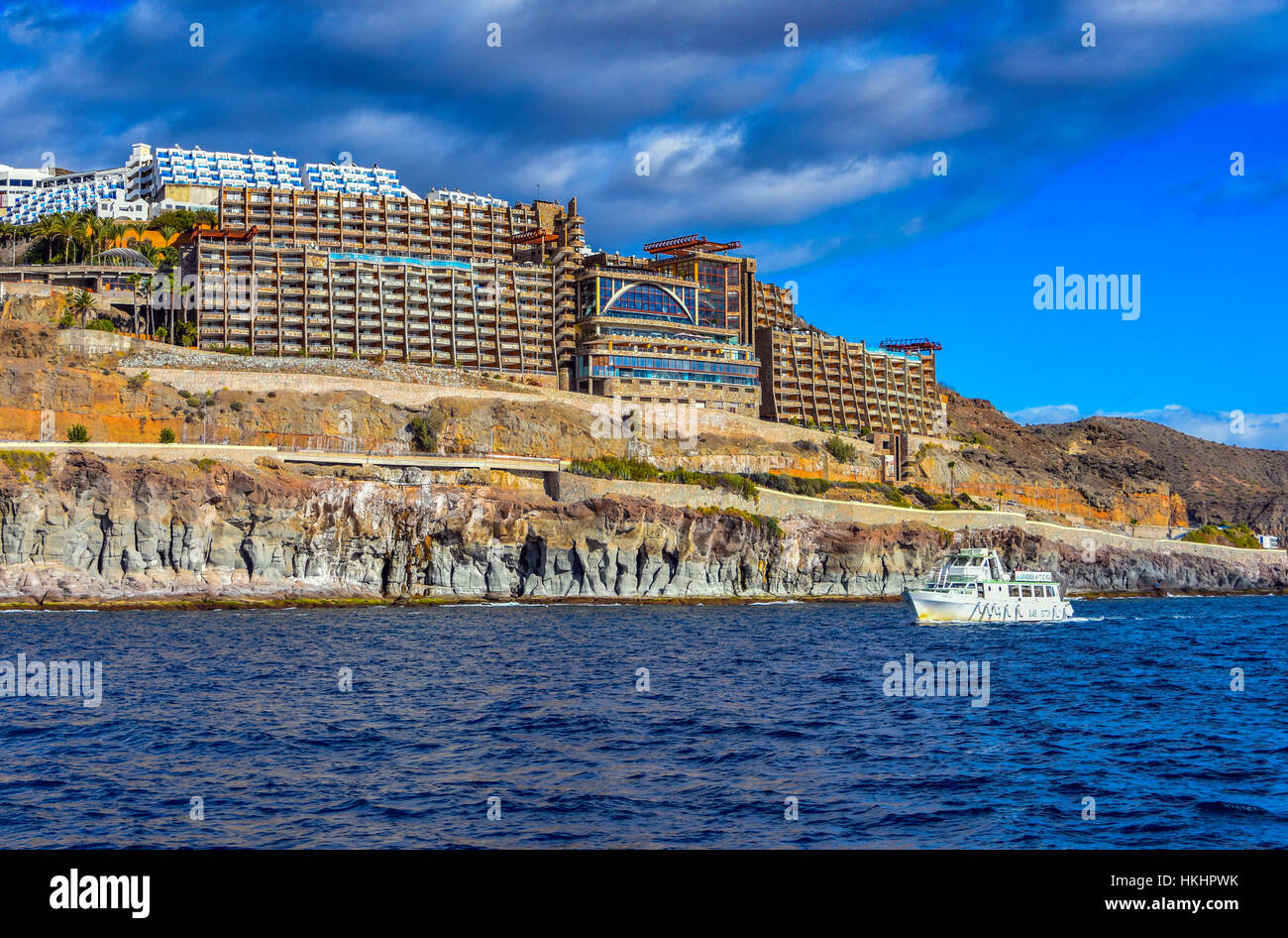White glass bottom ferry sailing past hotel complex, Gran Canaria Stock ...
