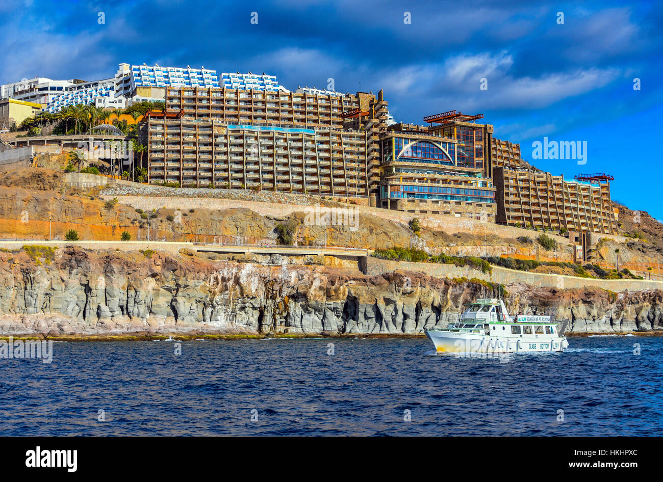 White glass bottom ferry sailing past hotel complex, Gran Canaria Stock ...