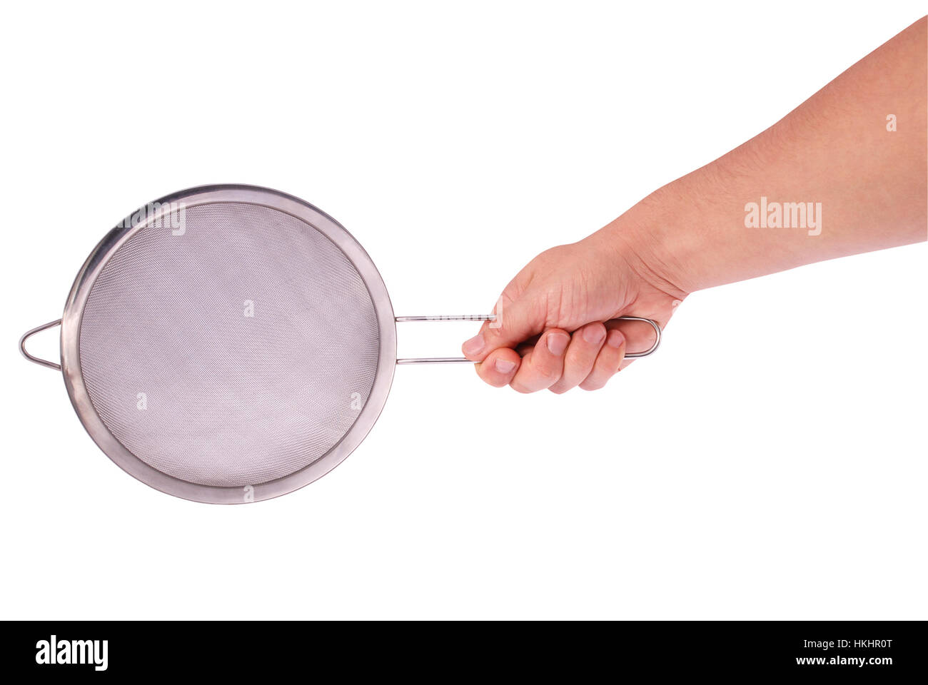Metal colander in hand on a white. Clipping path inside Stock Photo - Alamy