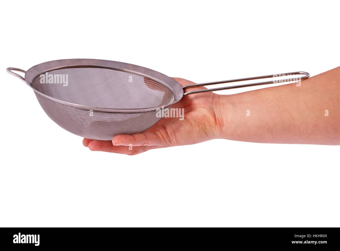 Metal colander in hand on a white. Clipping path inside Stock Photo - Alamy